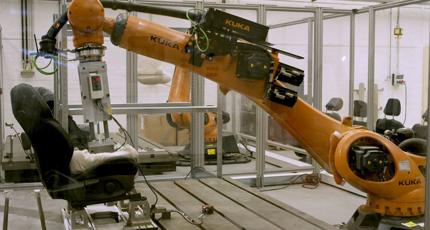 KUKA robotic test systems check car seats at Ford. | KUKA AG