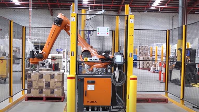 KUKA palletizing robot stacks boxes on an assembly line | KUKA AG
