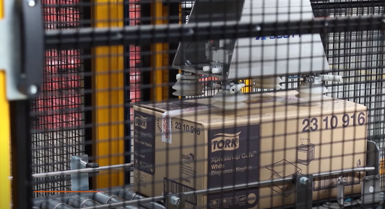 KUKA palletizing robot stacks boxes on an assembly line | KUKA AG